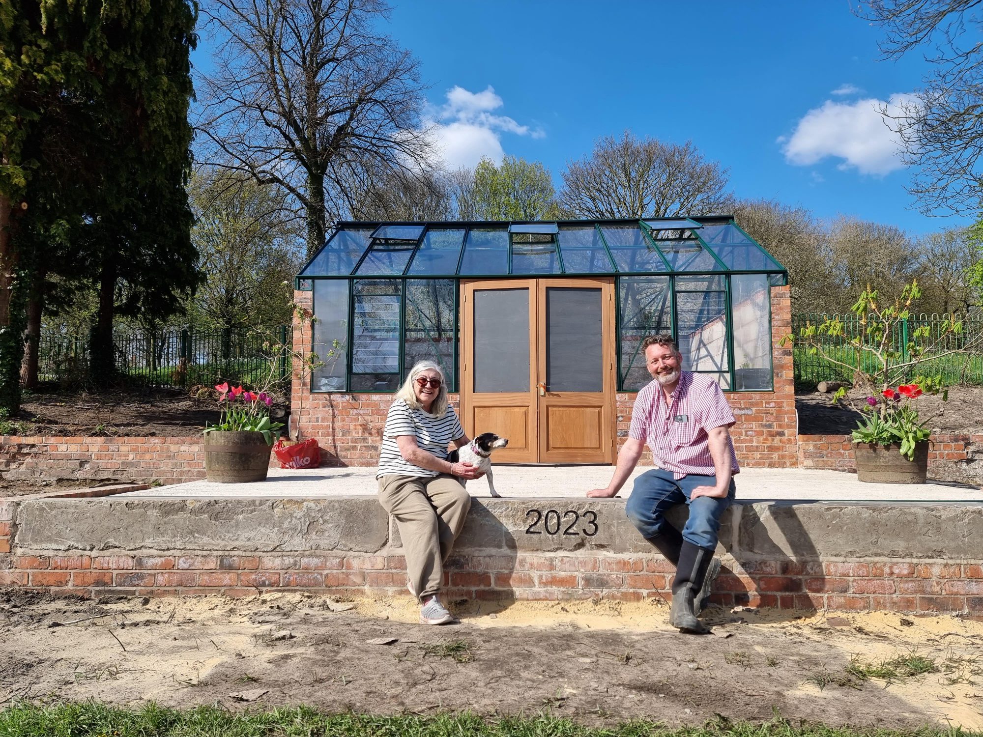 Salfordians work together to create new community greenhouse and gardens